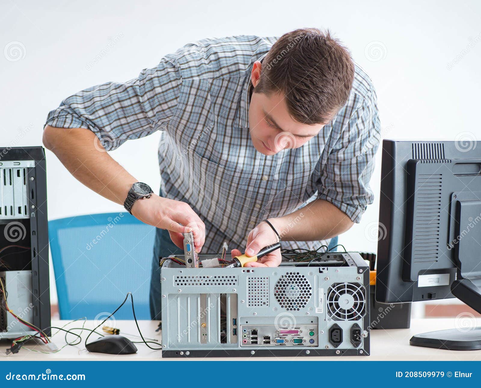 Young Technician Repairing Computer in Workshop Stock Image - Image of ...