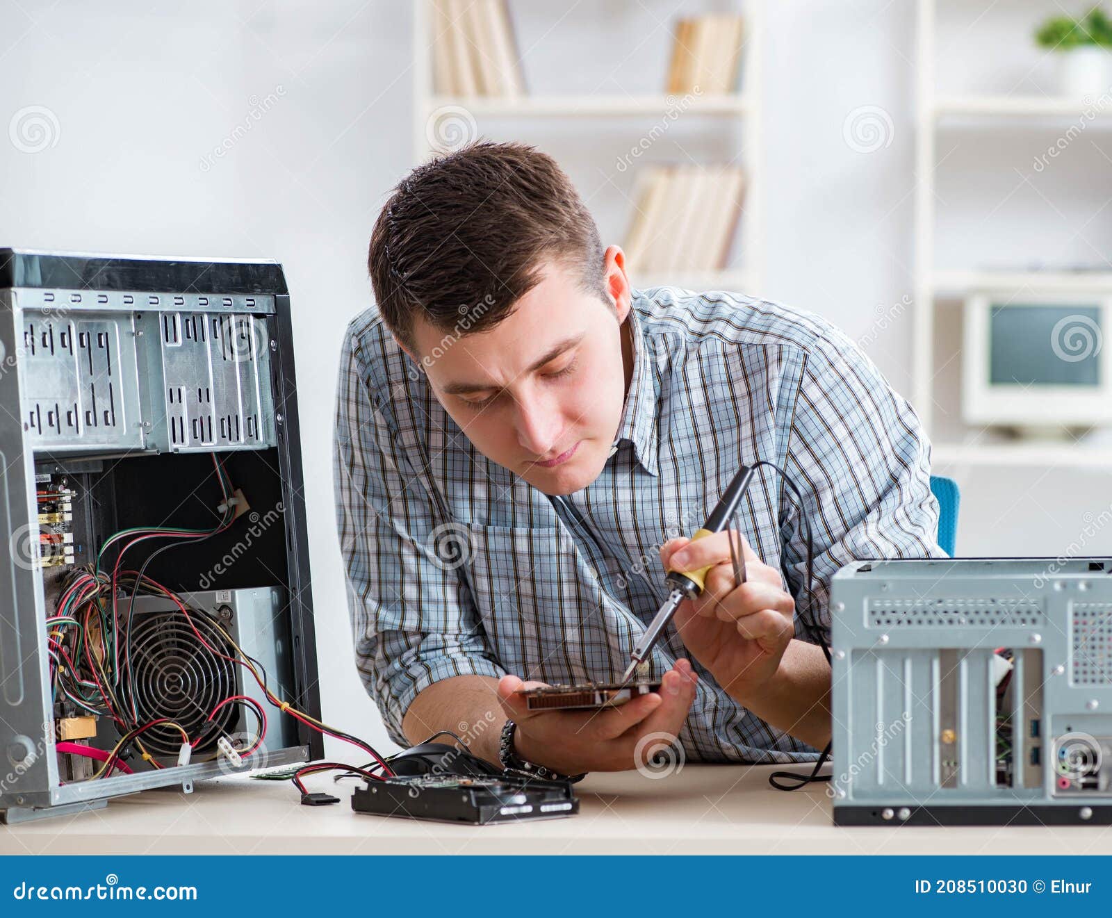 Young Technician Repairing Computer in Workshop Stock Photo - Image of ...