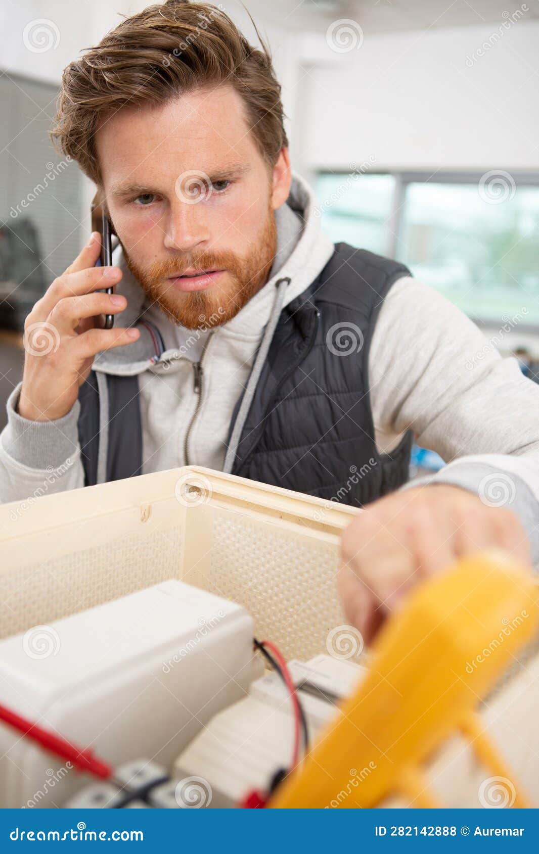 Young Technician Using Multimeter on Electrical Appliance Stock Photo ...