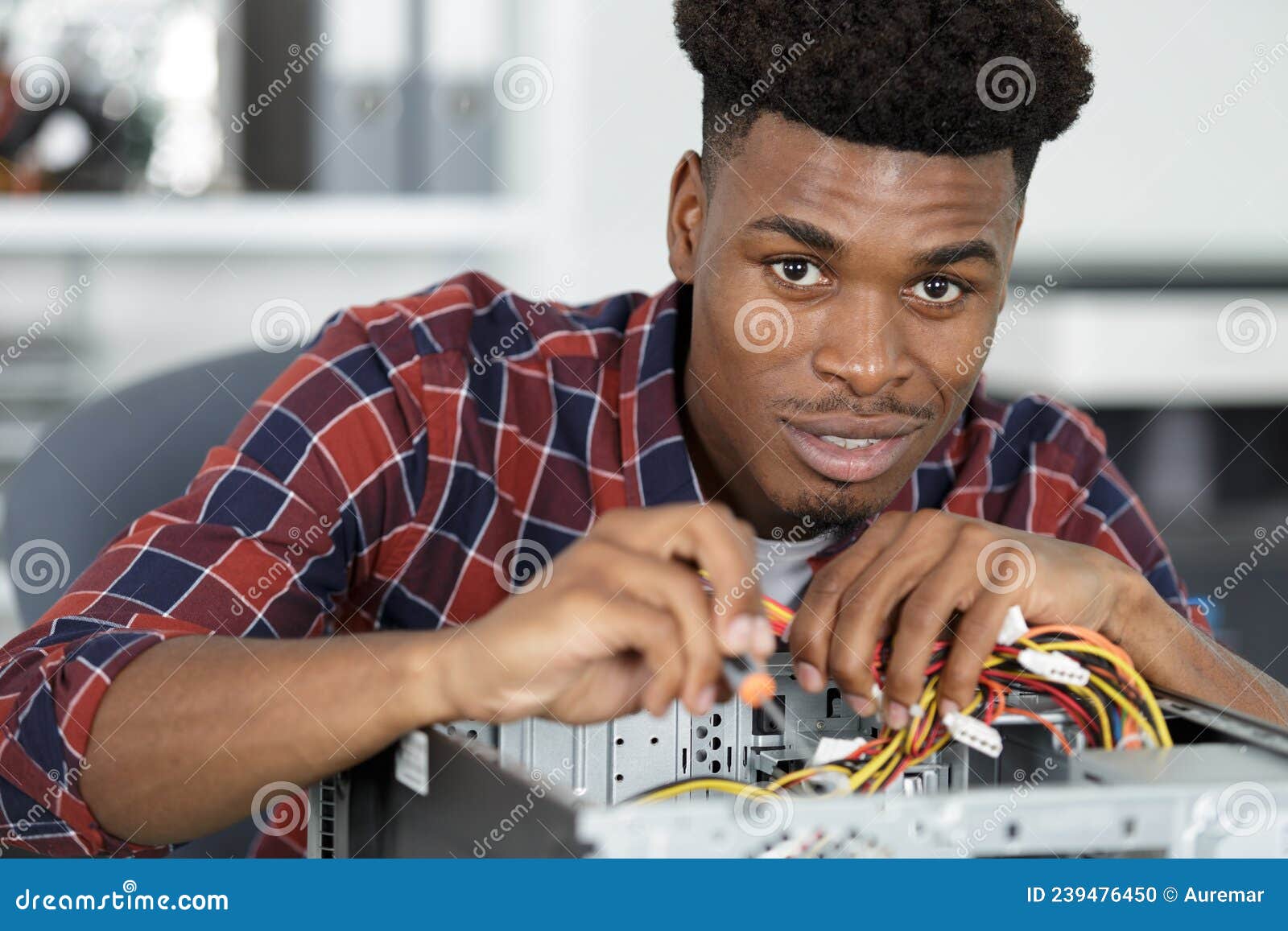 Young Technician Working on Broken Computer in Office Stock Photo ...