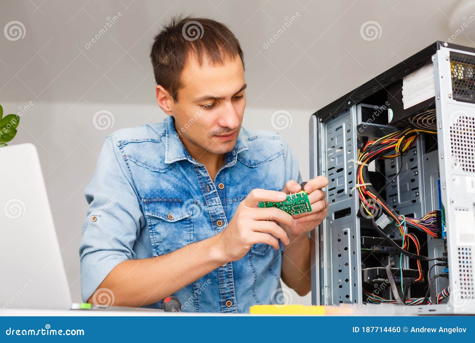 Young Technician Working on Broken Computer in His Office Stock Photo ...