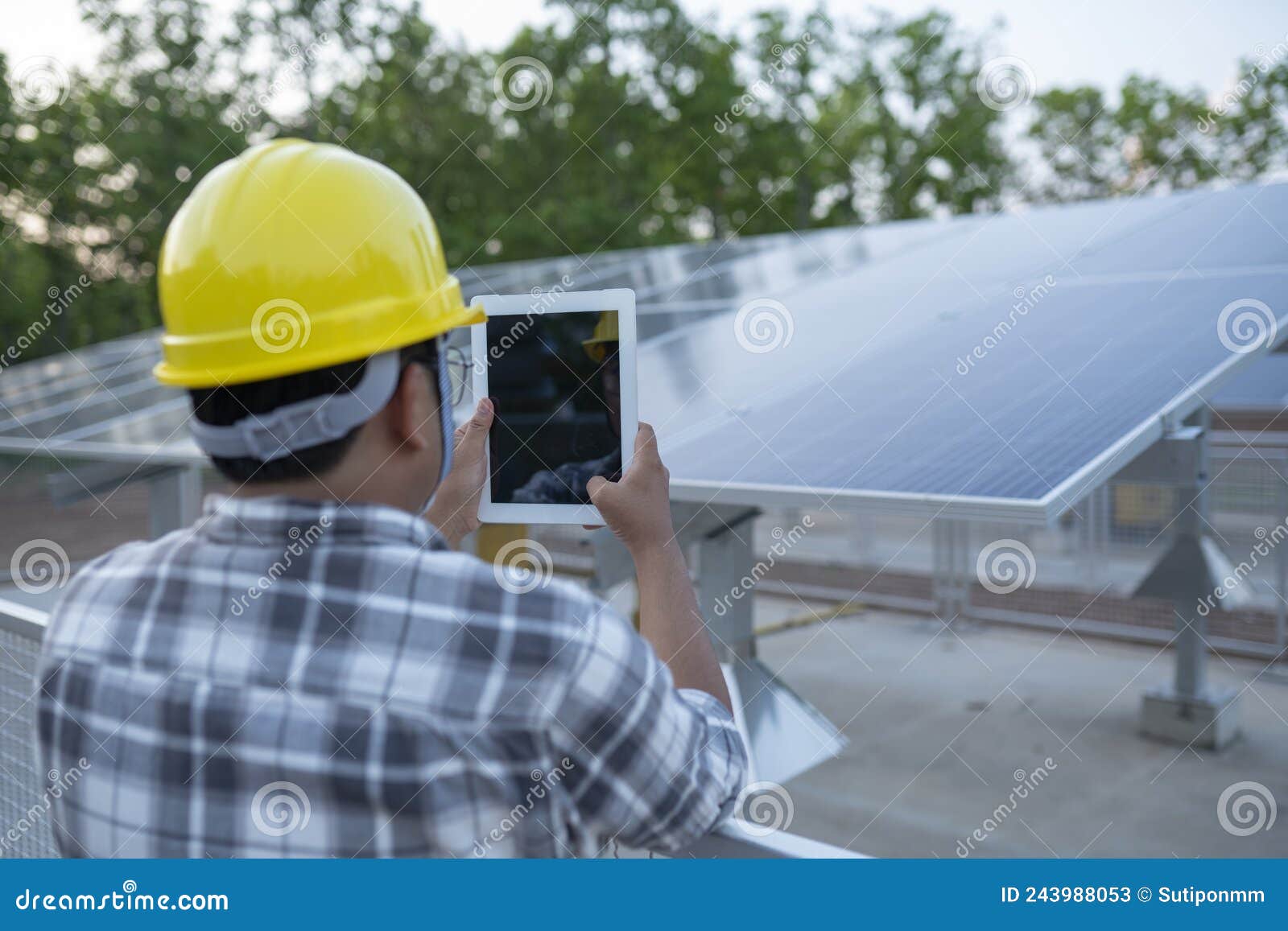 Young Technicians Use Tablet Control Solar Panel Power Station in the ...