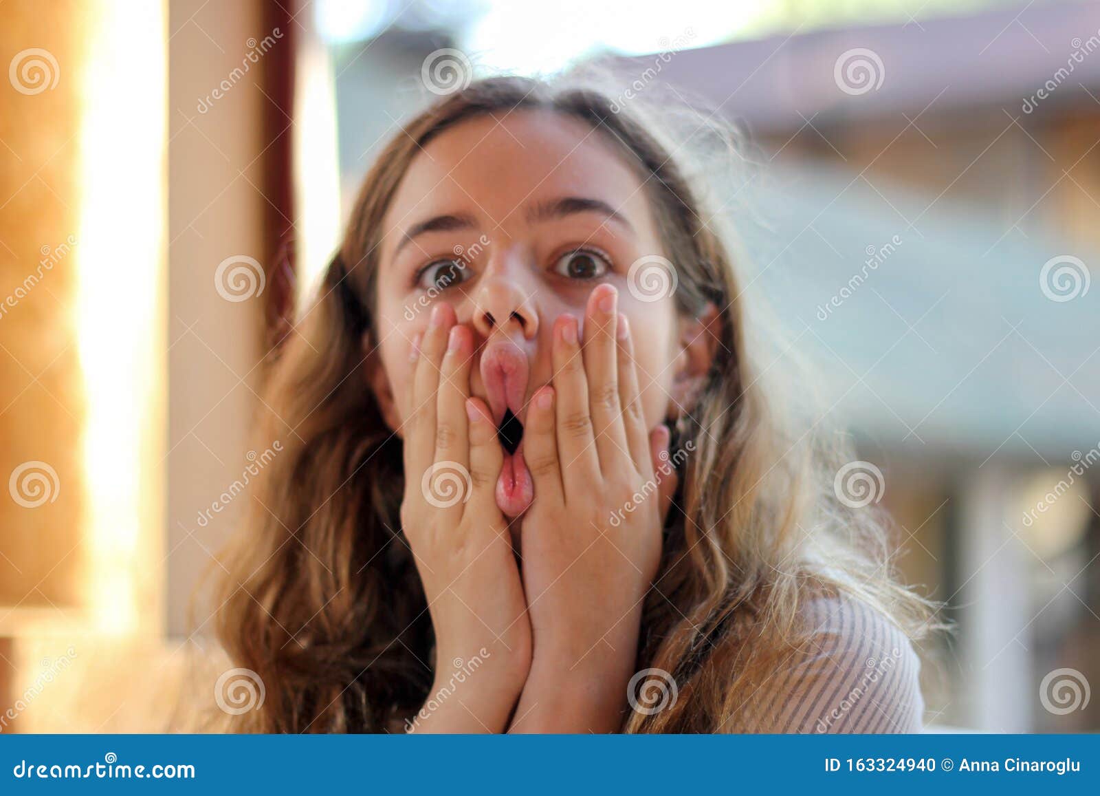Young Teenager Girl Fooling Around and Making Funny Faces Stock Photo ... Young Teenager Girl Fooling Around and Making Funny Faces Stock Photo ...