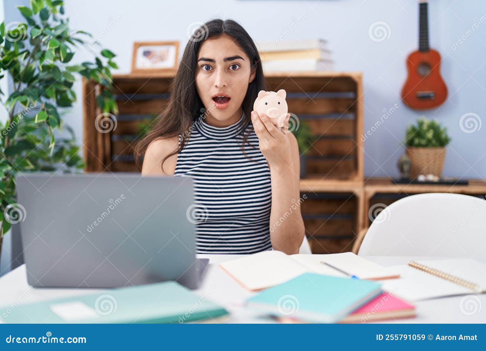 Young Teenager Girl Studying Using Computer Laptop Scared and Amazed ... Young Teenager Girl Studying Using Computer Laptop Scared and Amazed ...