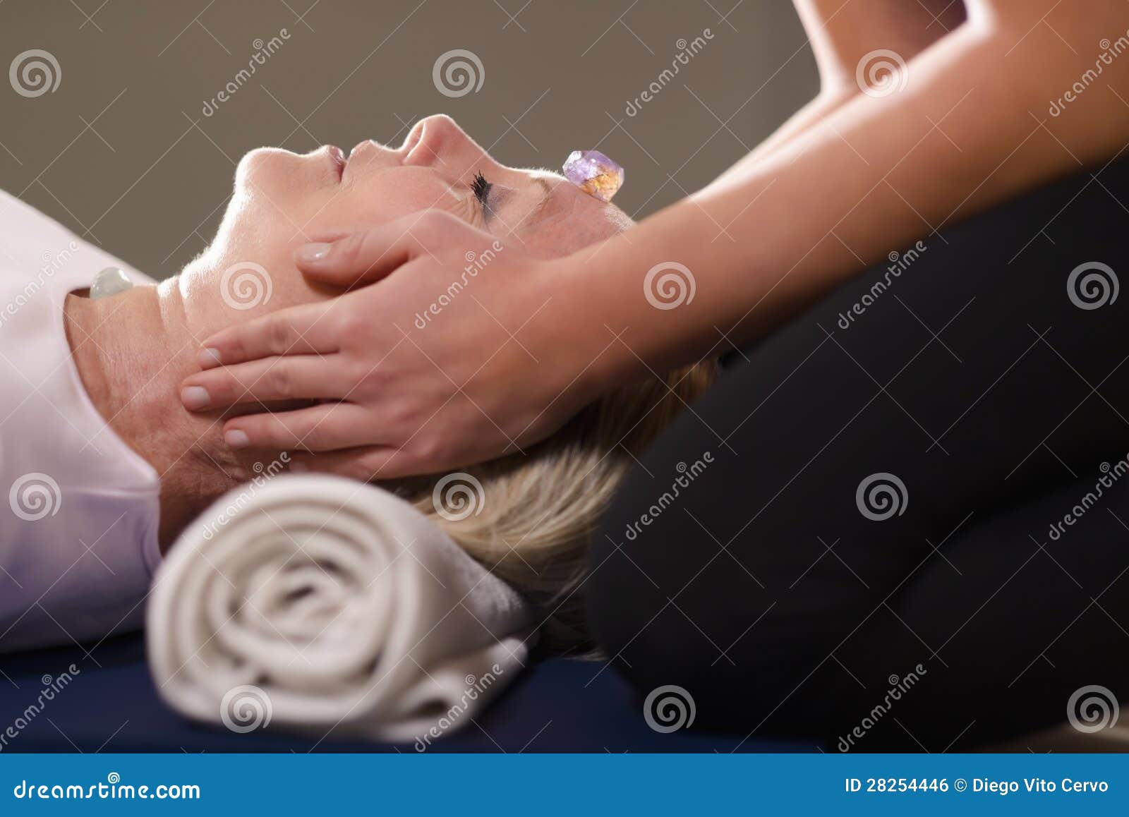 Young Therapist Arranging Crystals on Female Client for Reiki Th Stock ...