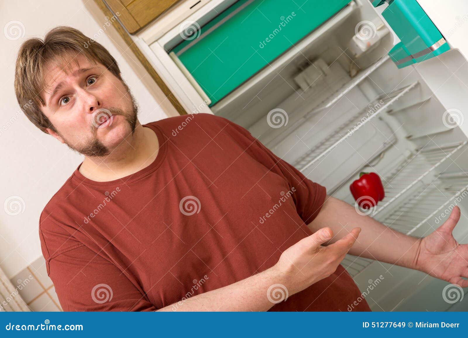 Young Thick Man in Front of a Fridge with One Paprika Inside Stock ...
