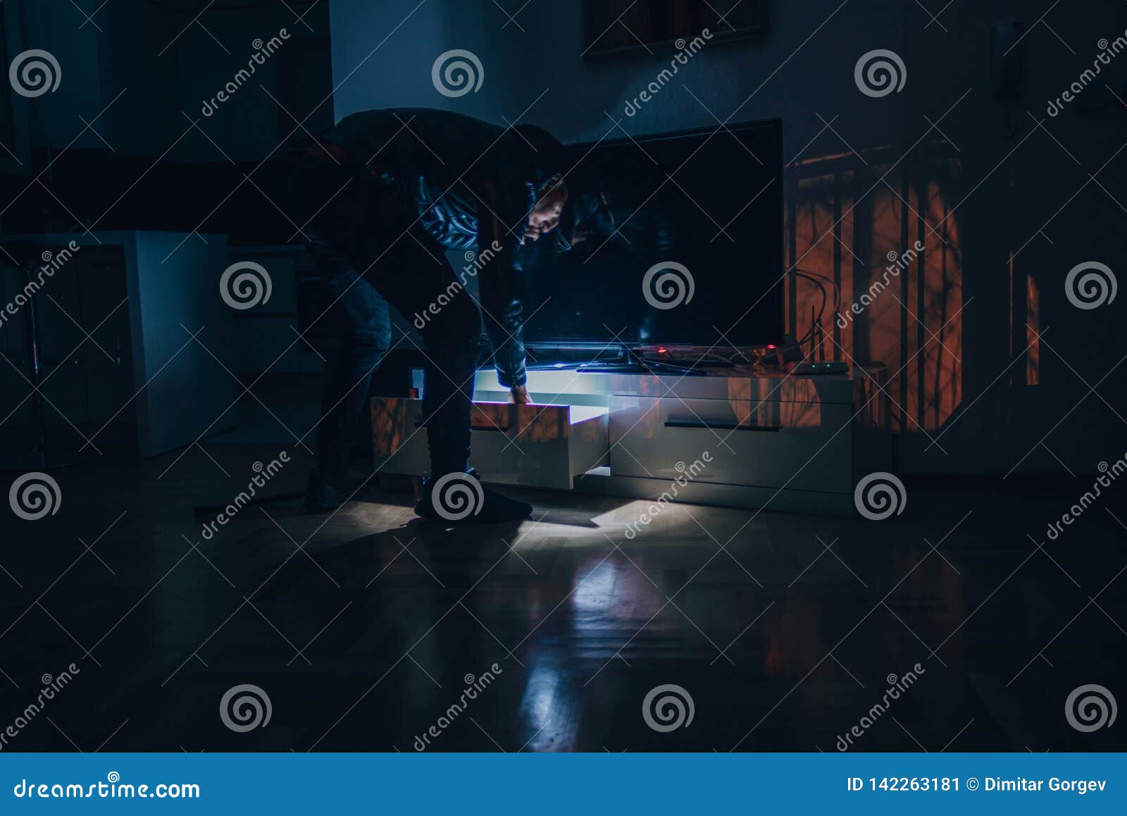 Young Thief Walk in the Apartment and Stealing from the Desk Stock ...