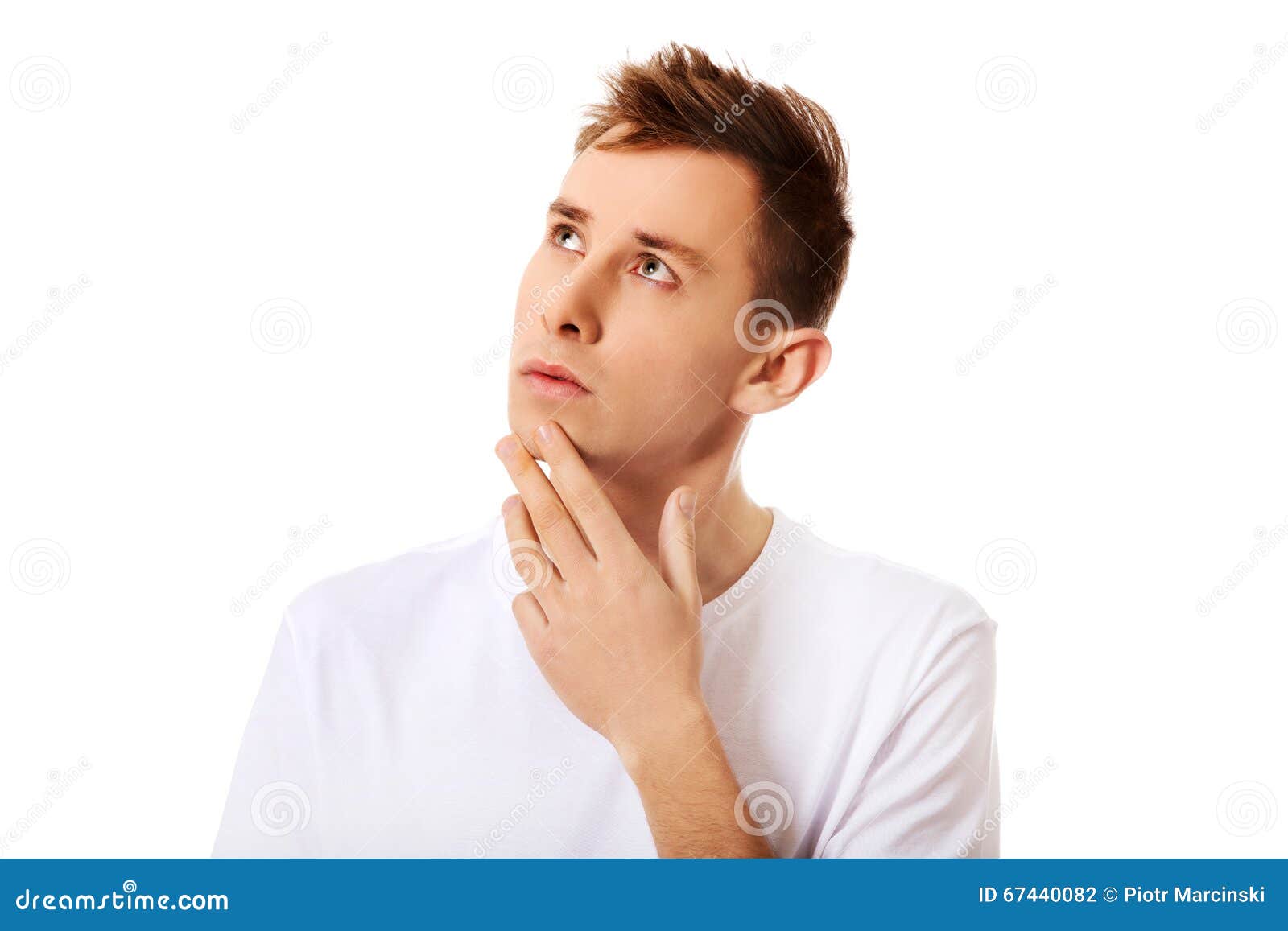 Young Thinking Man Looks Up with Hand Near Face Stock Photo - Image of ...