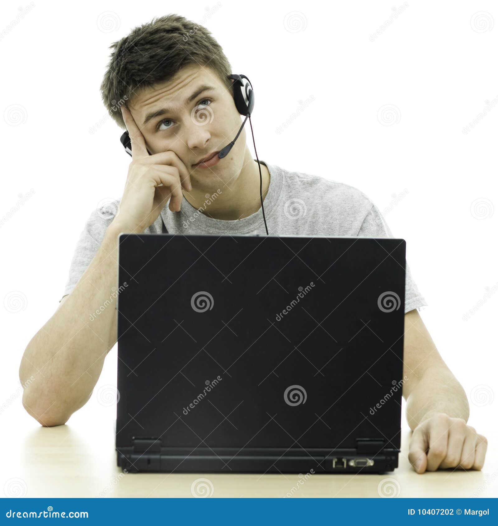 Young Thinking Man Sitting Next To the Laptop Stock Photo - Image of ...