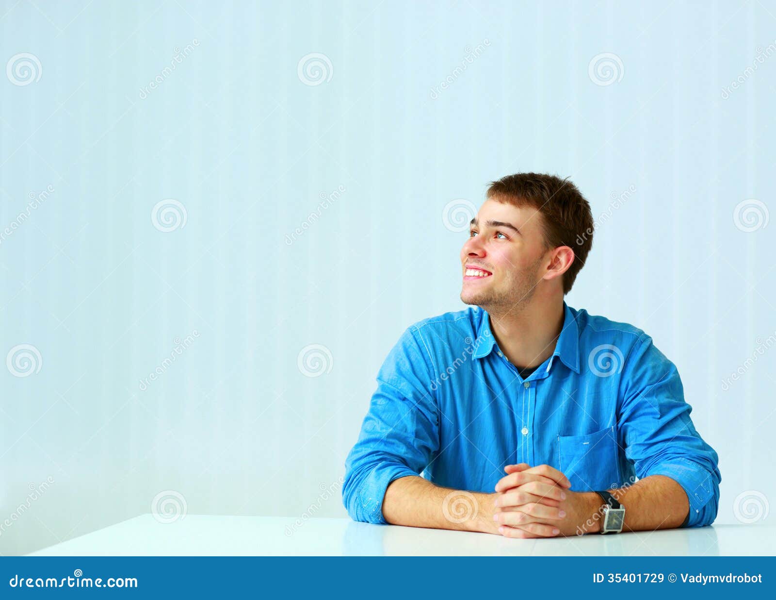 Young Thoughtful Businessman Sitting at the Table and Looking Up Stock ...