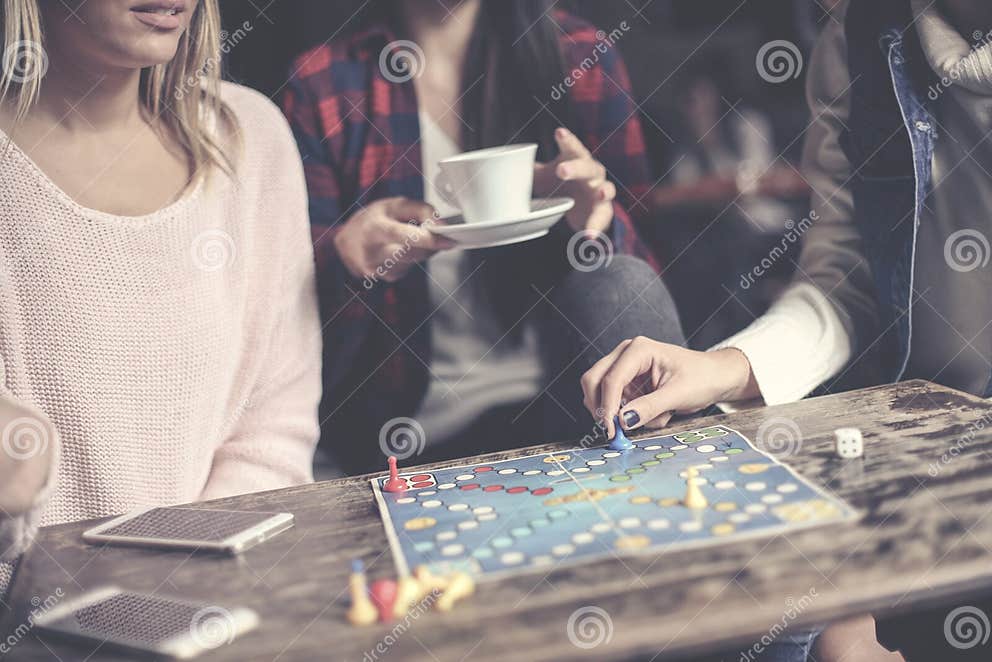 Three Girls Play Together A Social Game Focus On Hand Stock Image