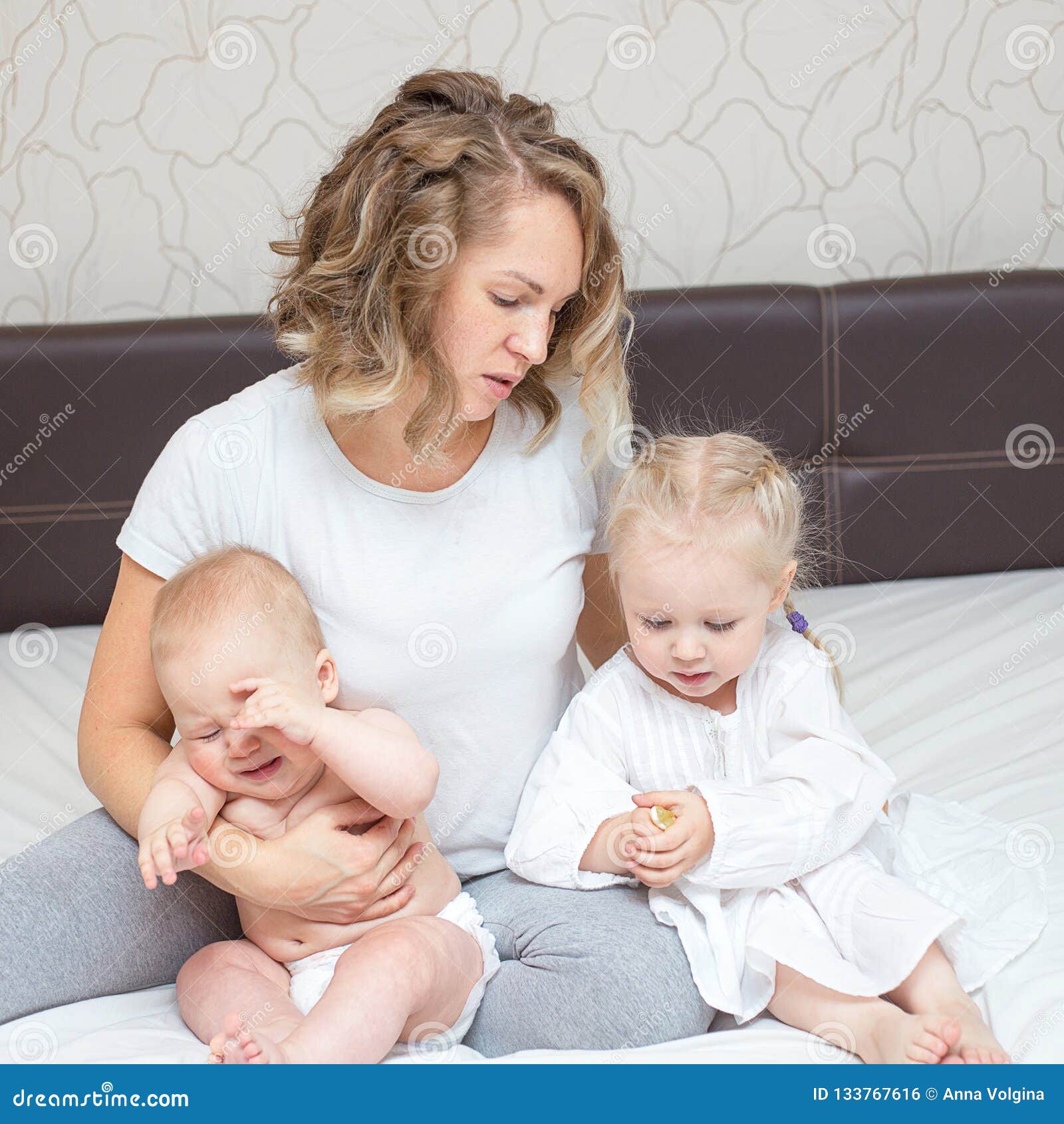 Young Tired Mother with Her Two Kids Stock Photo - Image of home ...