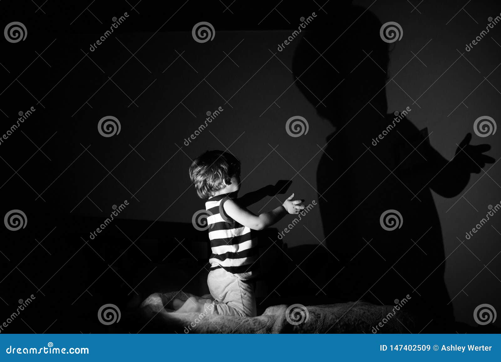 Young Toddler Boy Playing with His Shadow. Stock Image - Image of ...