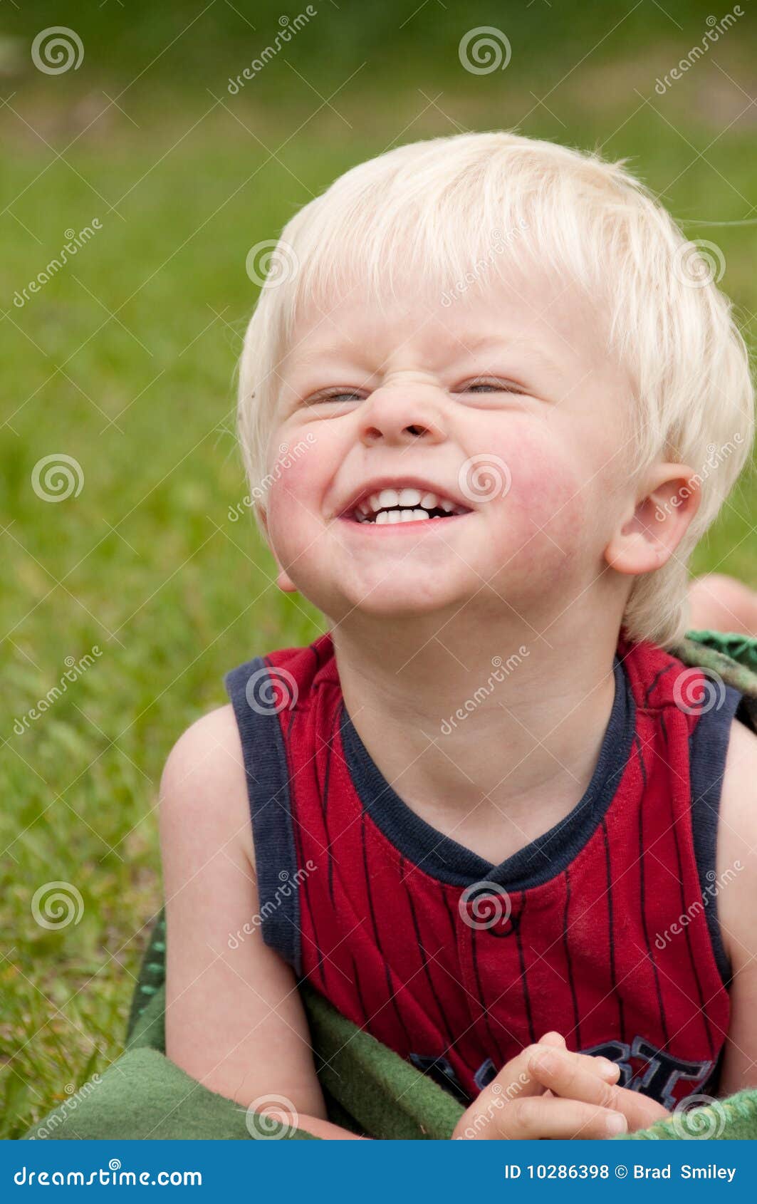 A Young Toddler Smiles Big in the Yard Stock Photo - Image of smile ...