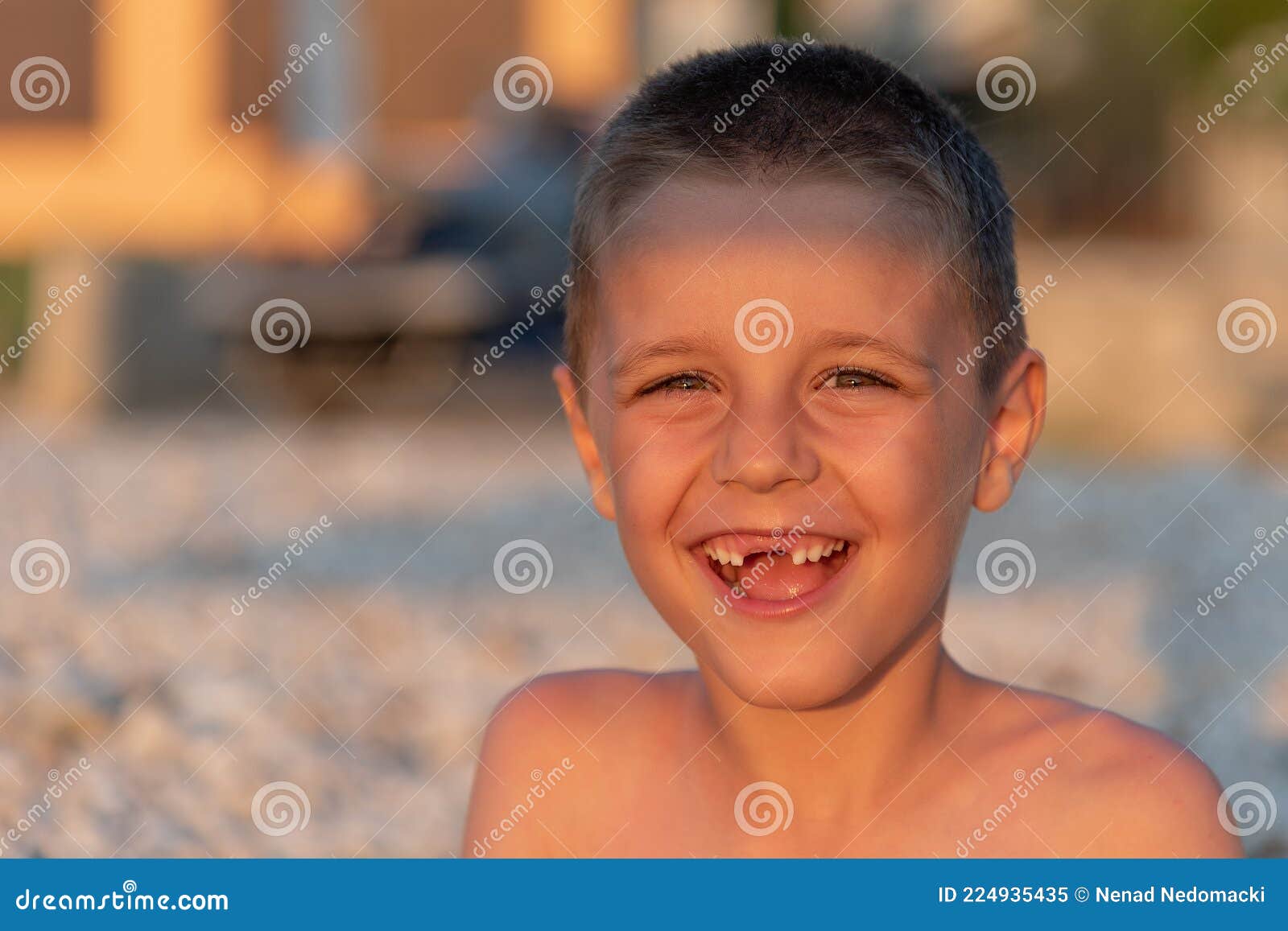Young Toothless Boy at the Beach Stock Image - Image of adult, beach ...