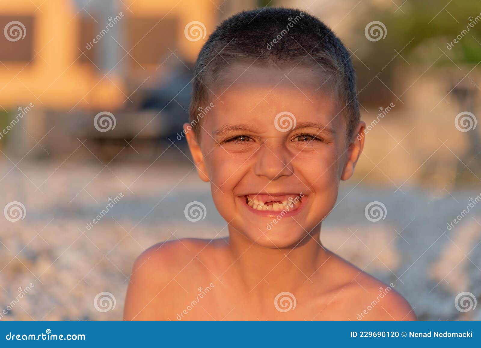 Young Toothless Boy at the Beach Stock Photo - Image of coastal ...