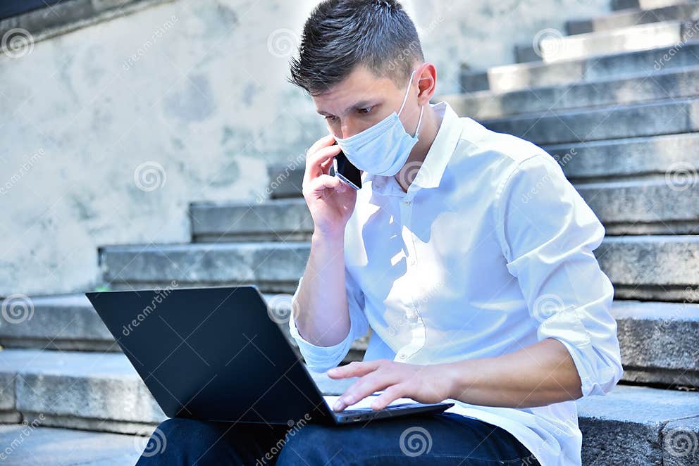 Young Trader Man in Mask Working Outdoor with Laptop Stock Image ... Young Trader Man in Mask Working Outdoor with Laptop Stock Image ...
