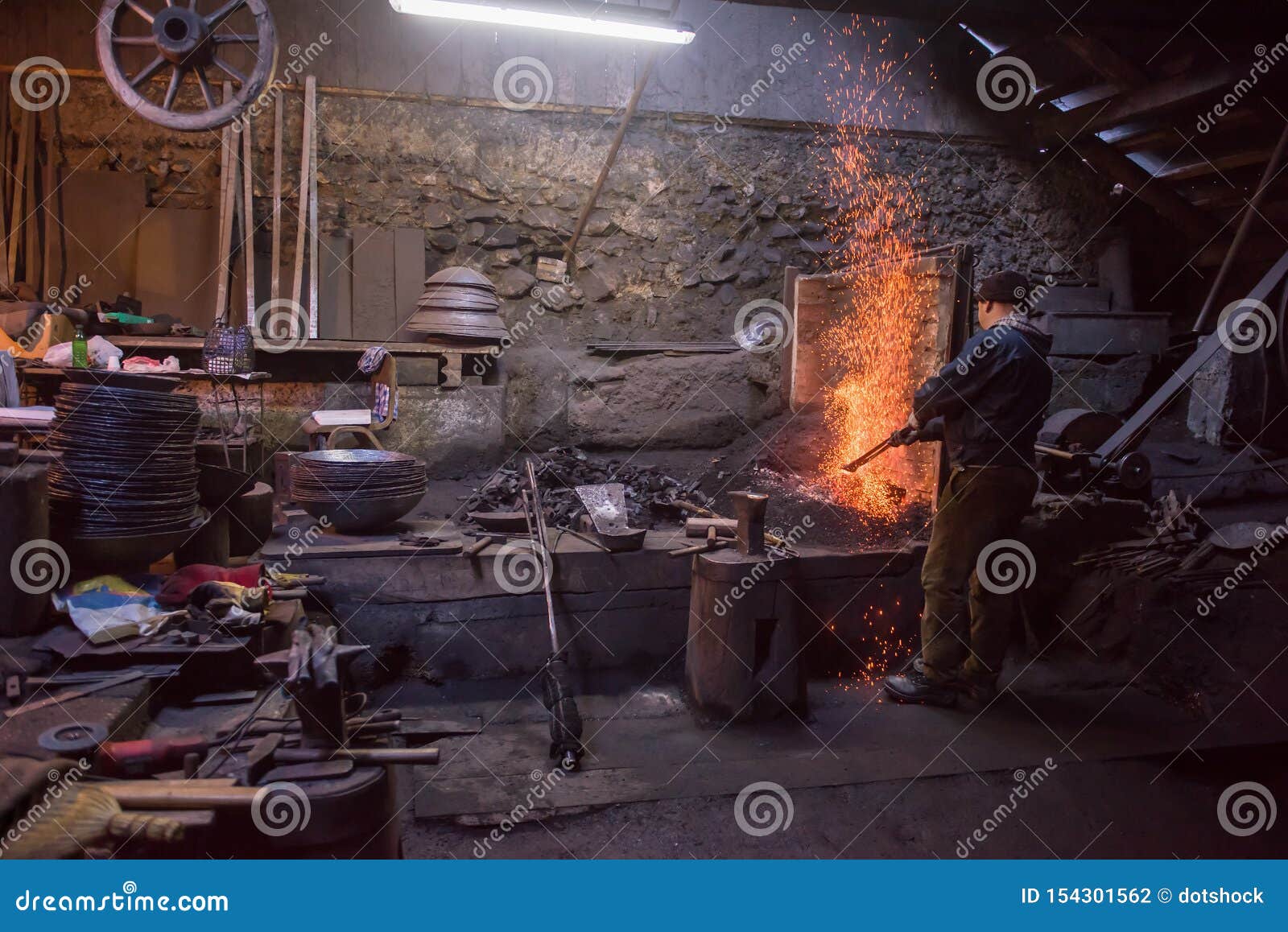 Young Traditional Blacksmith Working with Open Fire Stock Photo - Image ...