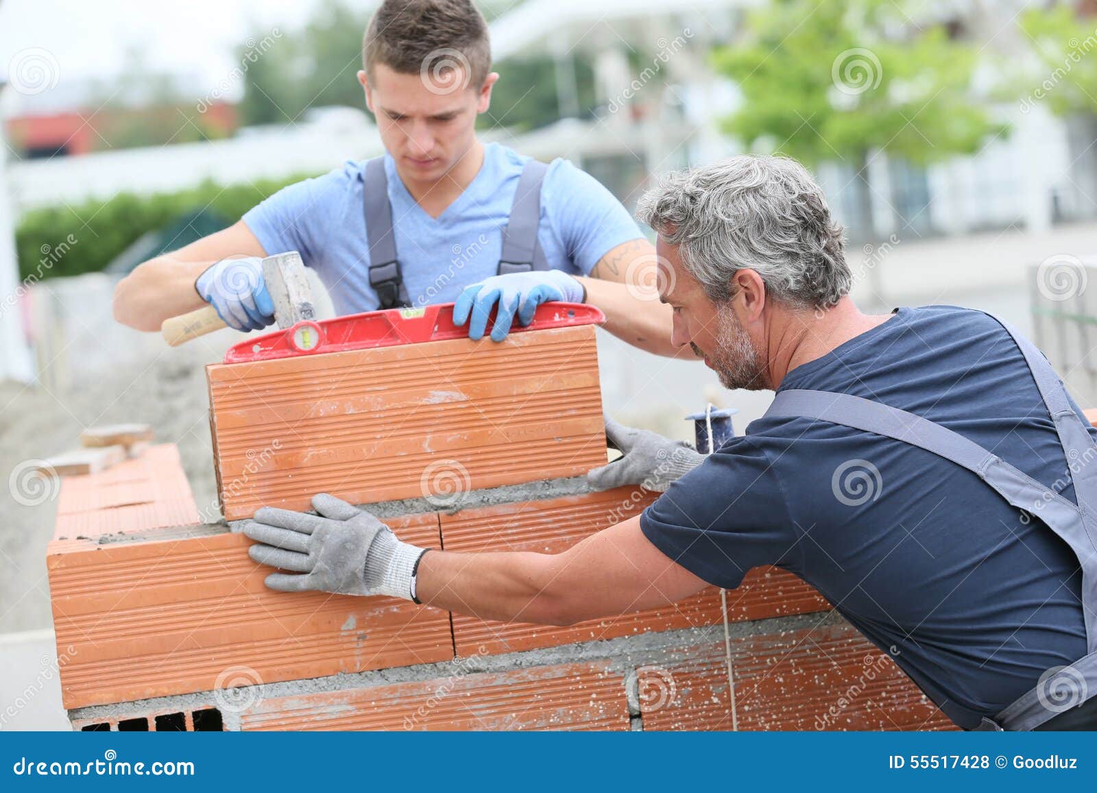 Young Trainee Learning Masonry with Instructor Stock Photo - Image of ...
