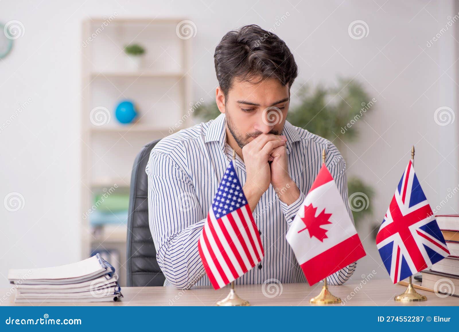 Young Male Translator Sitting in the Office Stock Image - Image of ...