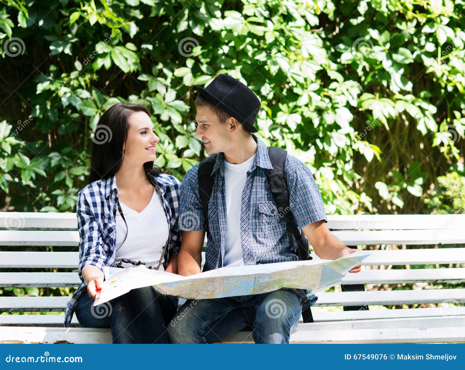 Young Traveling Couple Checking Out the Map in the Park Stock Photo ...