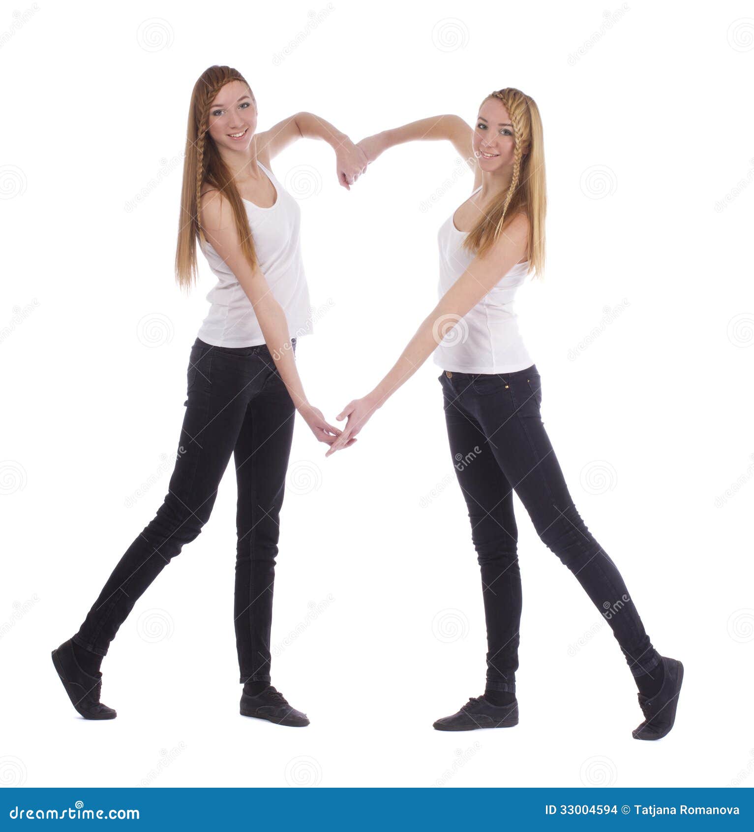 Young Twins Sisters Making Heart Shape with Arms Stock Photo - Image of ...
