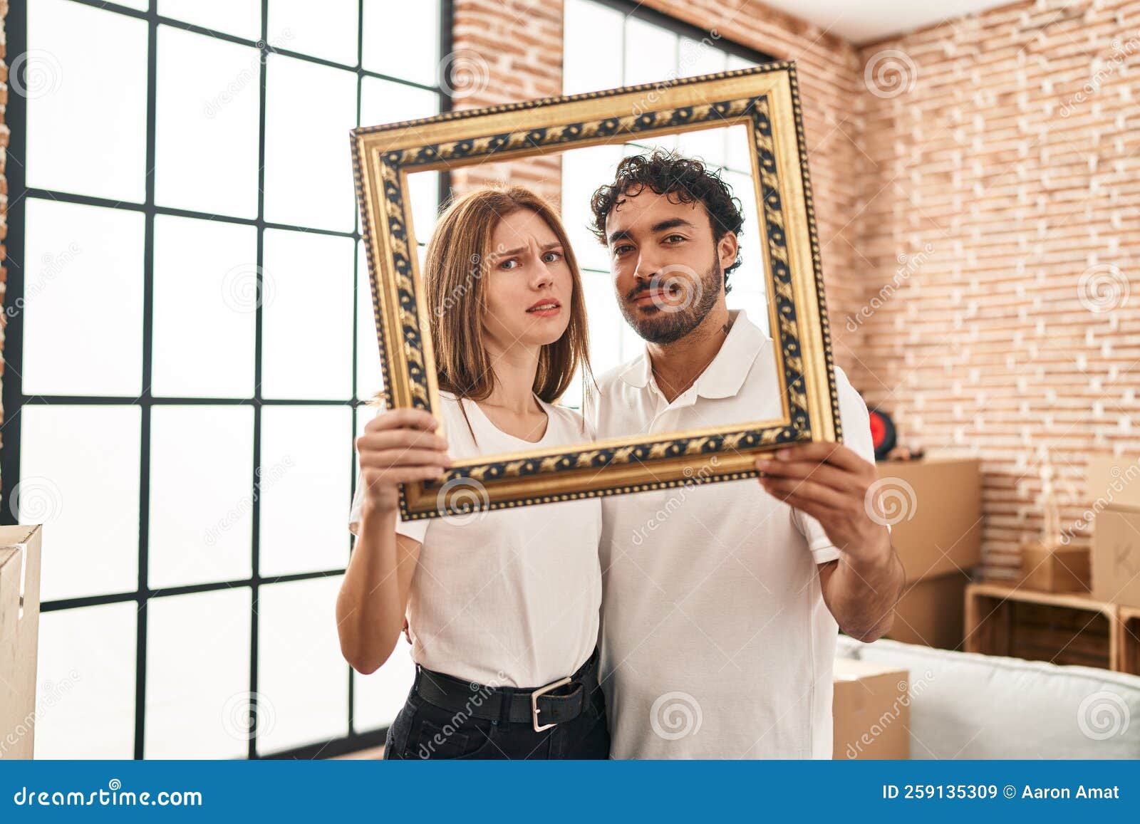 Young Two People Holding Empty Frame Together Clueless and Confused ...