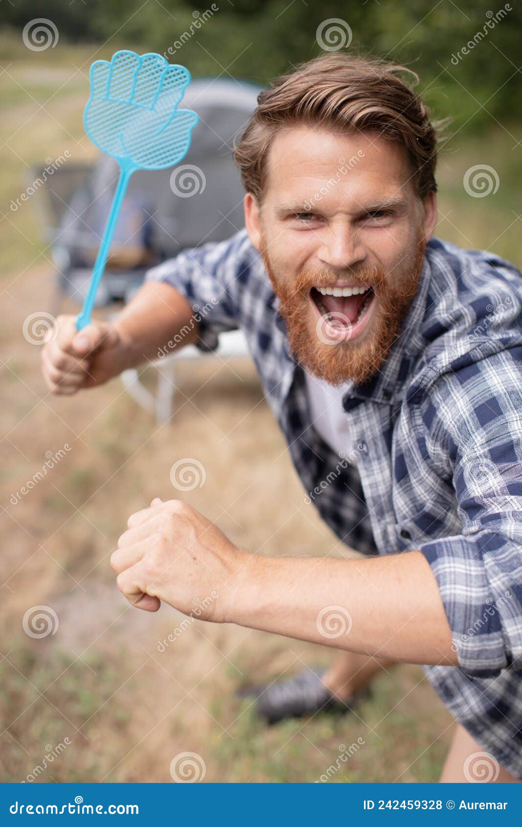 Young Unhappy Man Killing Flies while Camping Stock Photo - Image of ...