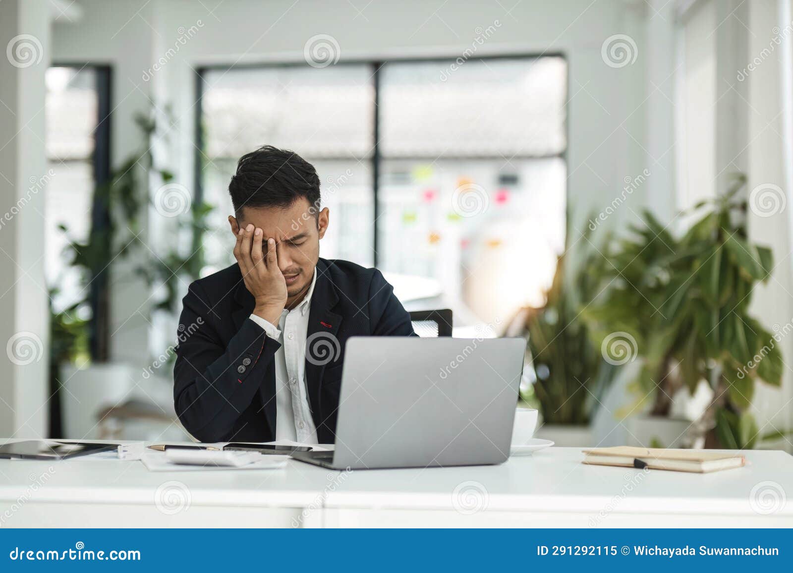Young Unhappy Man Office Worker Feeling Bored at Work, Looking at ...