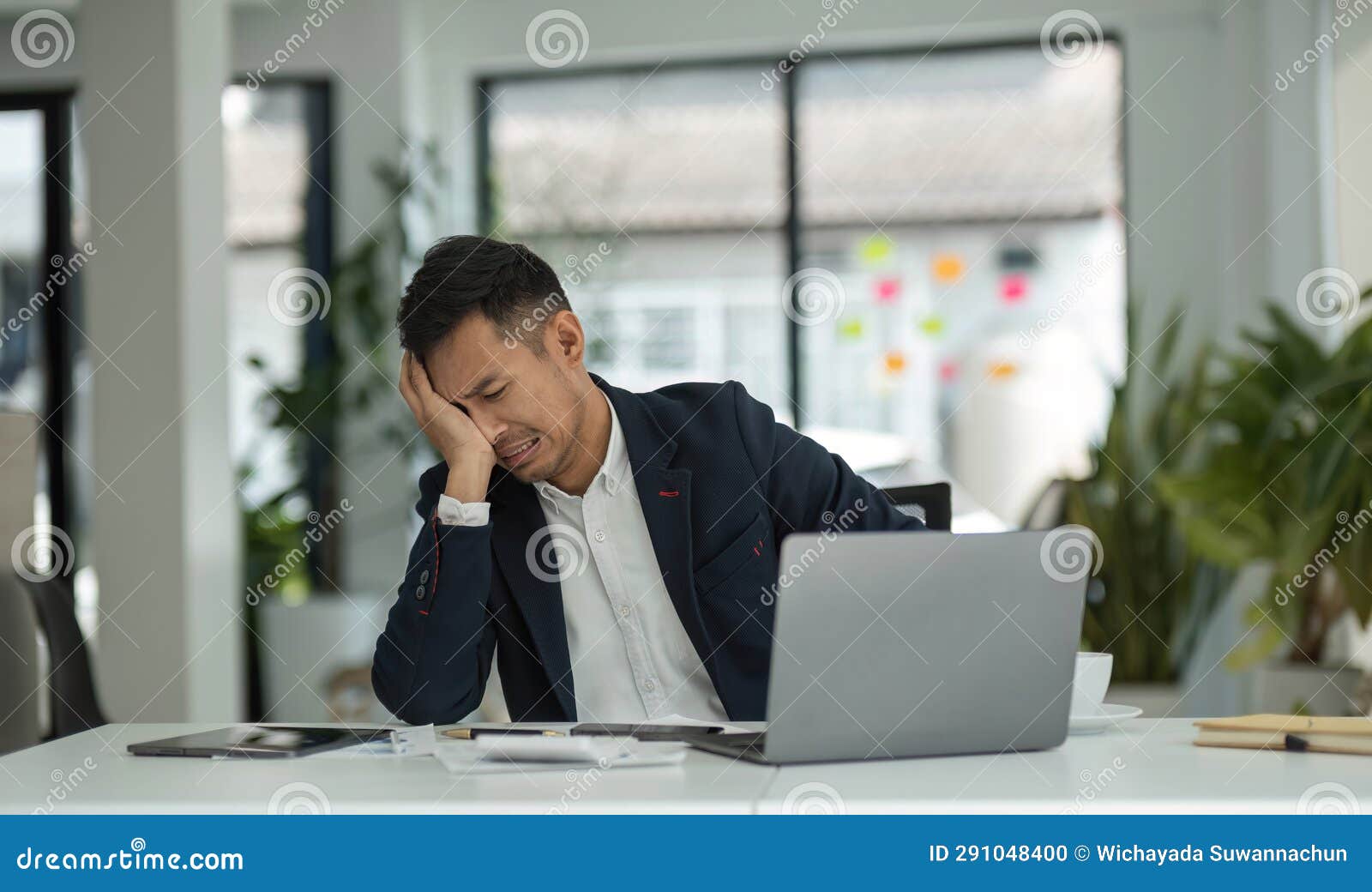 Young Unhappy Man Office Worker Feeling Bored at Work, Looking at ...