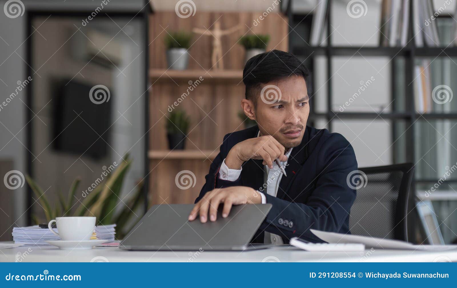 Young Unhappy Man Office Worker Feeling Bored at Work, Looking at ...