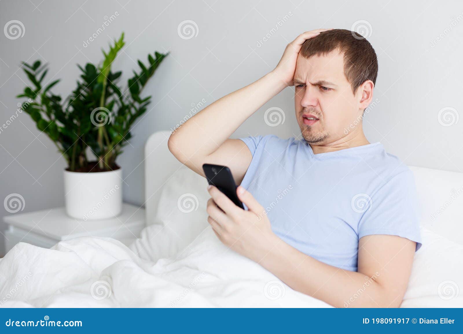 Young Upset Man Using Smartphone in Bed Stock Image - Image of people ...