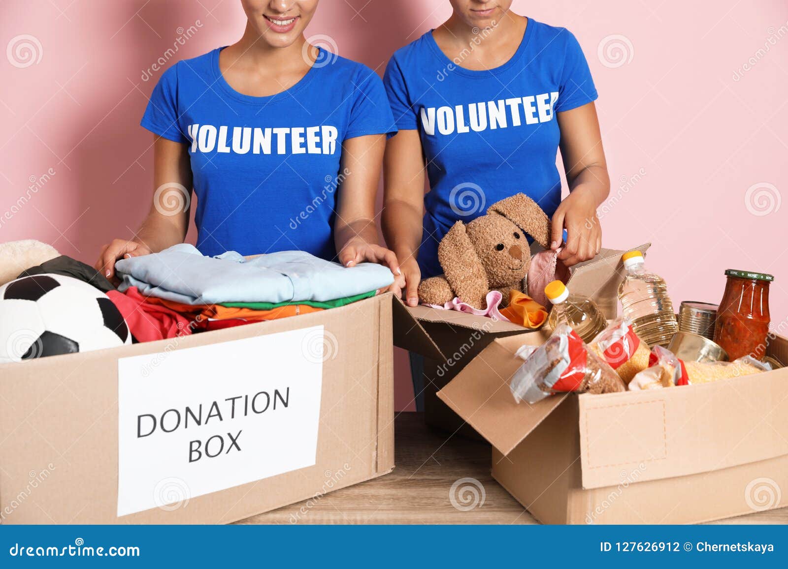 Young Volunteers Collecting Donations at Table Stock Photo - Image of ...