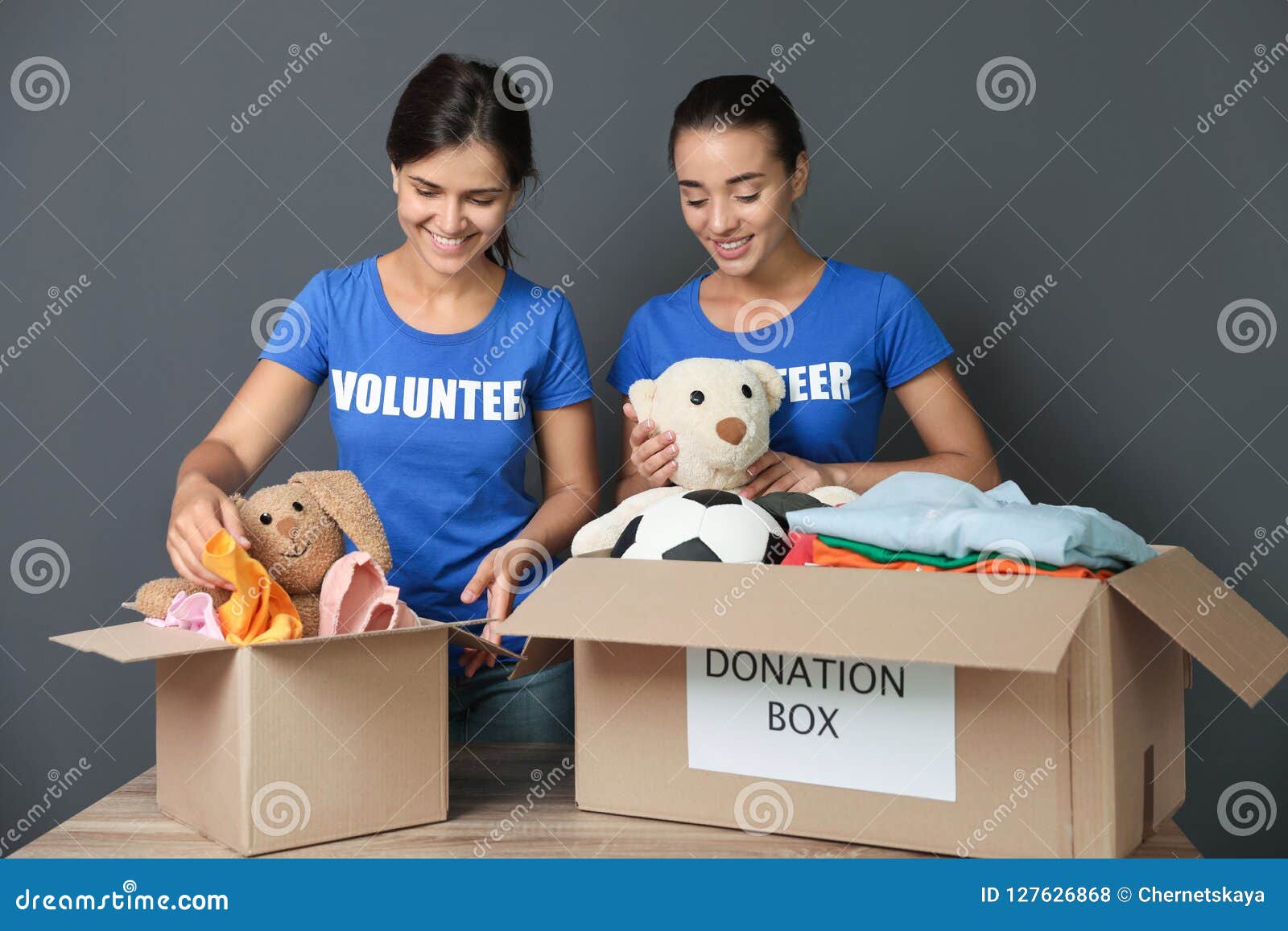 Young Volunteers Collecting Donations at Table Stock Photo - Image of ...