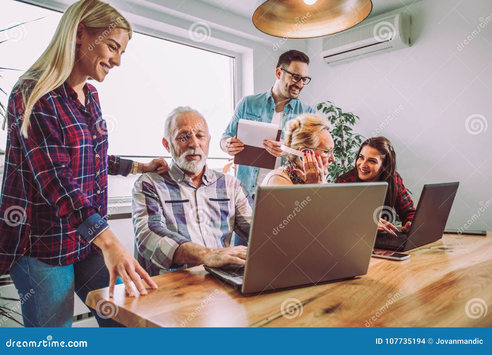 Volunteers Help Senior People on the Computer Stock Photo - Image of ...