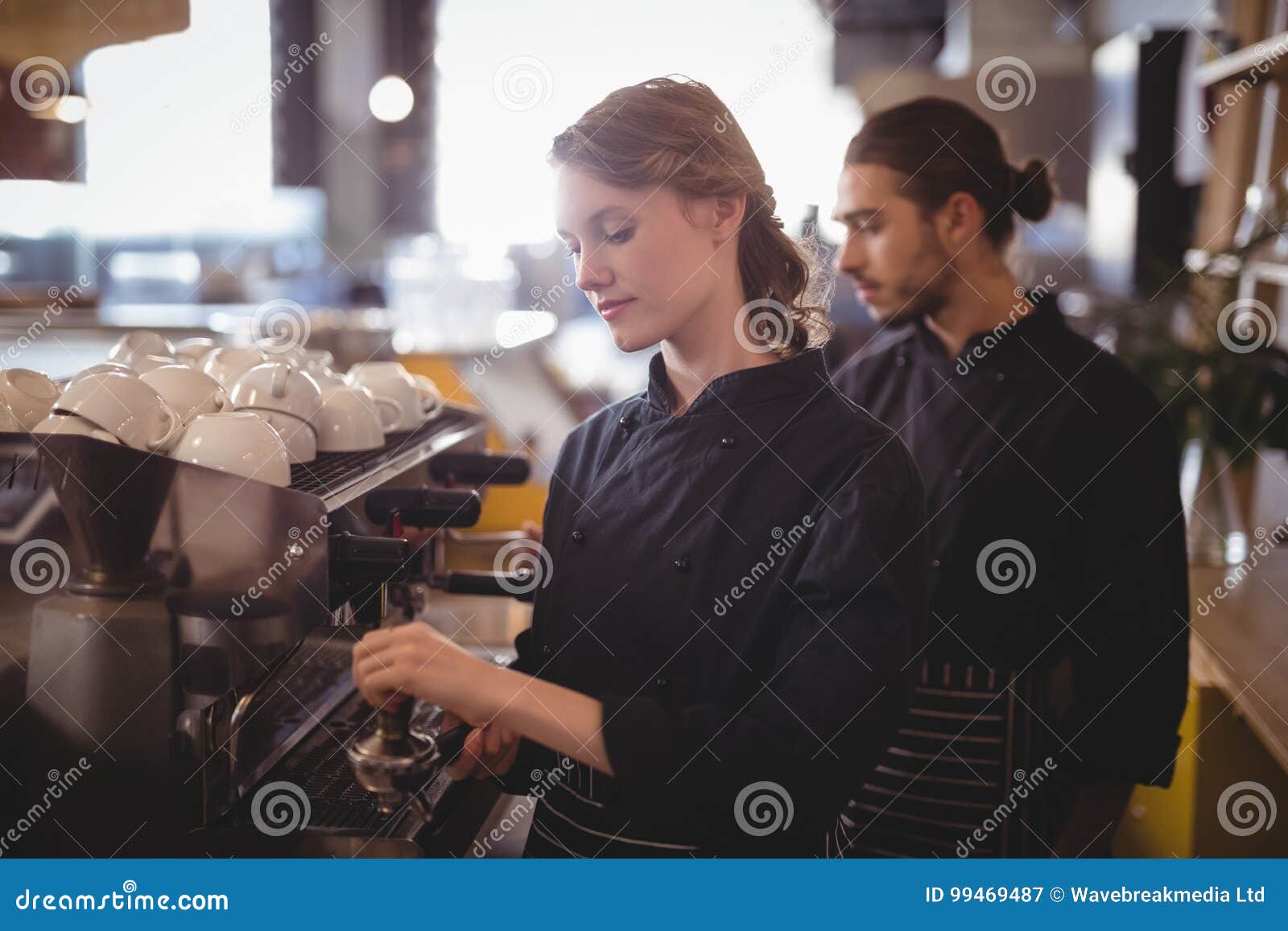 Young Wait Staff Using Espresso Maker at Coffee Shop Stock Image ...