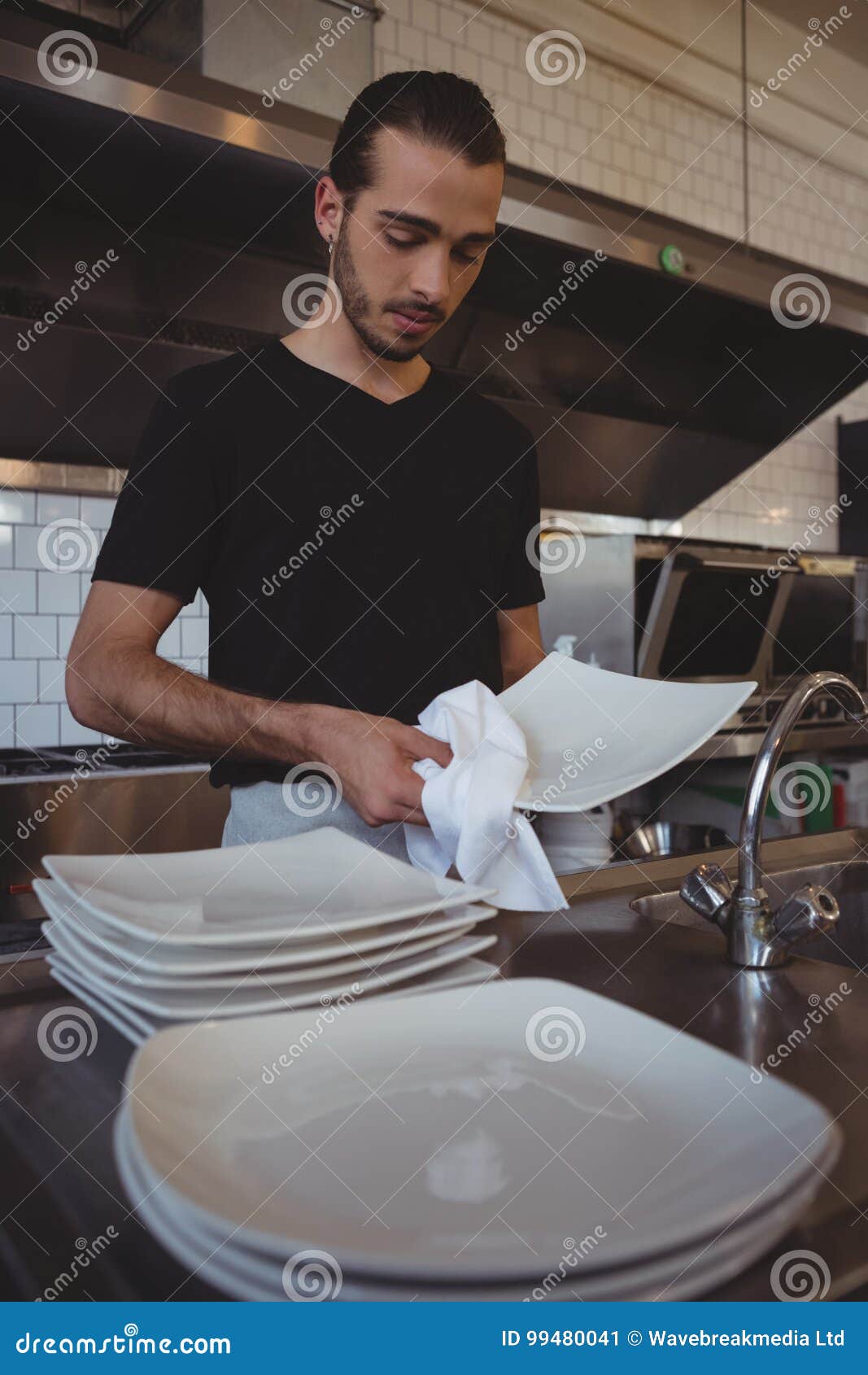 Waiter Cleaning Plates in Cafe Stock Image - Image of holding ...