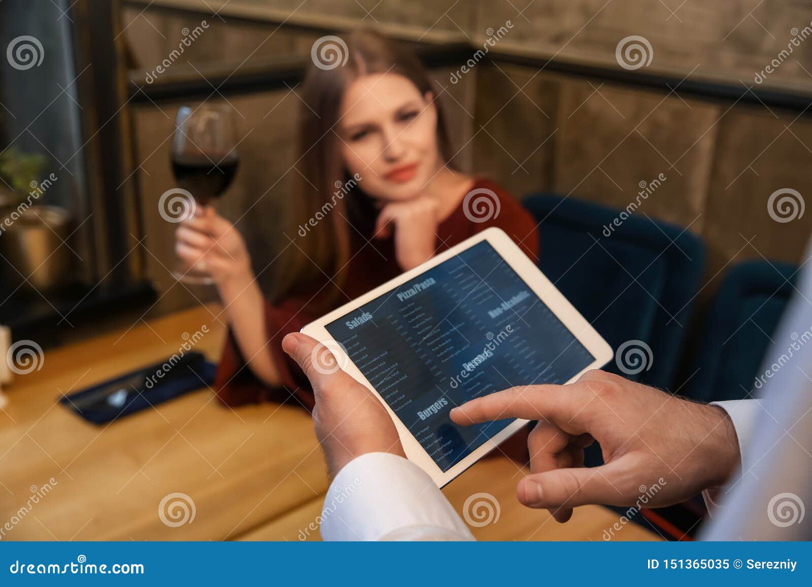 Young Waiter with Menu on Tablet PC Screen in Restaurant Stock Image ...