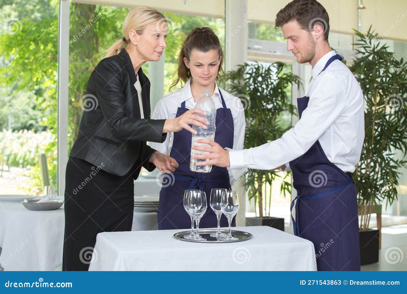 Young Waiter and Waitress at Service in Restaurant Stock Image - Image ...