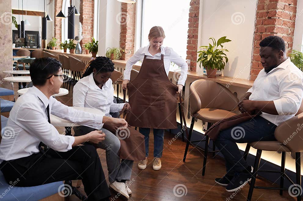 Young Waiting Staff Getting Ready for Work Stock Image - Image of chat ...