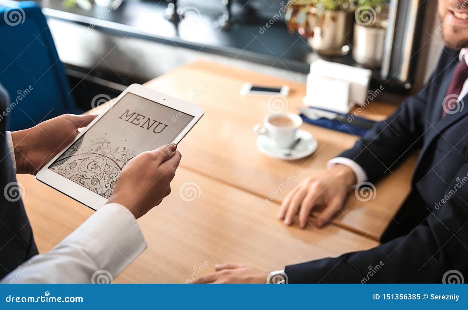 Young Waitress with Menu on Tablet PC Screen in Restaurant Stock Image ...