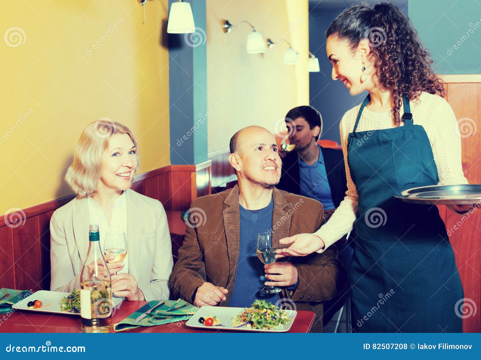 Young Waitress Taking Order at Table Stock Photo - Image of garson ...