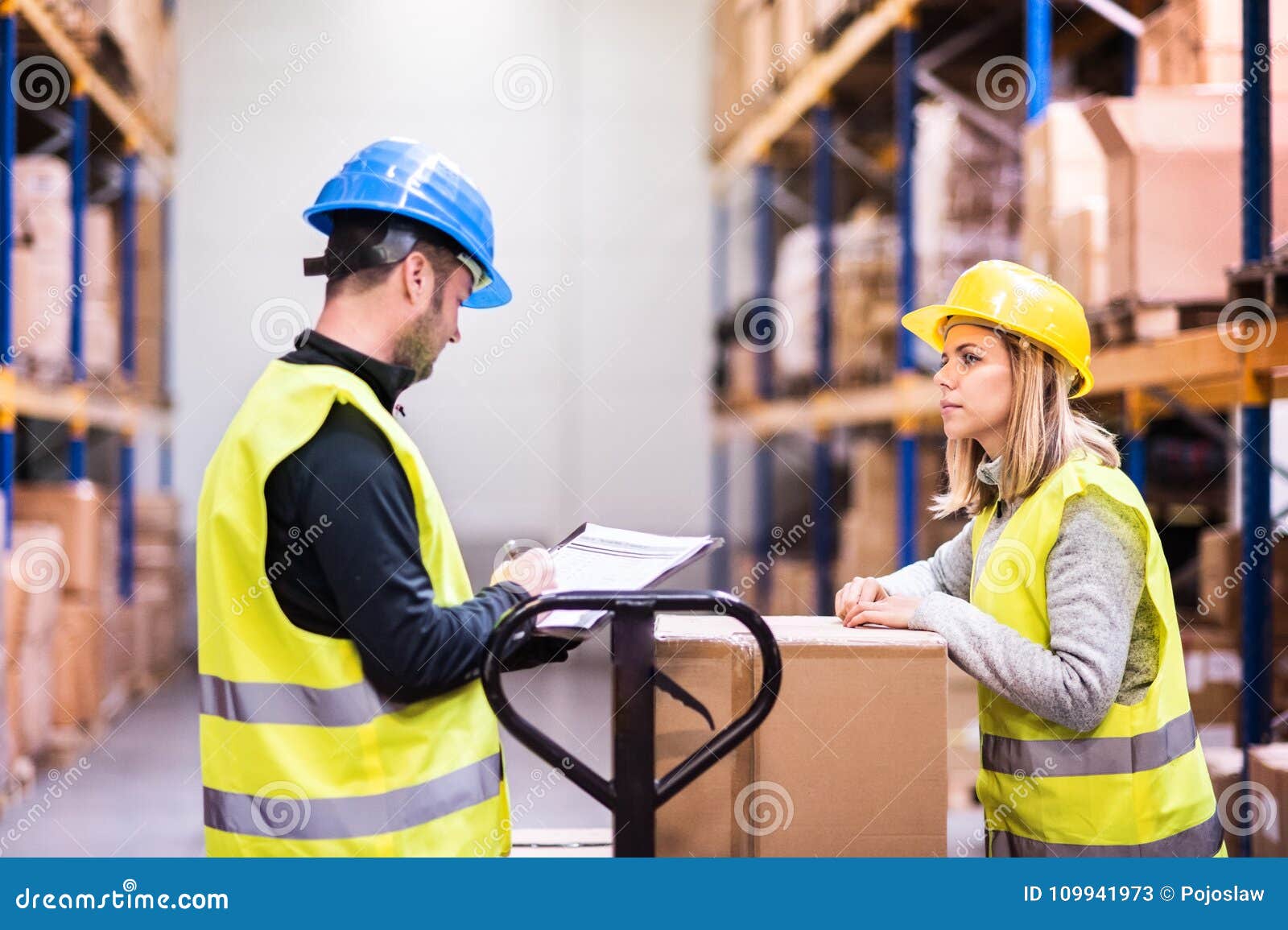 Young Warehouse Workers Working Together. Stock Image - Image of ...