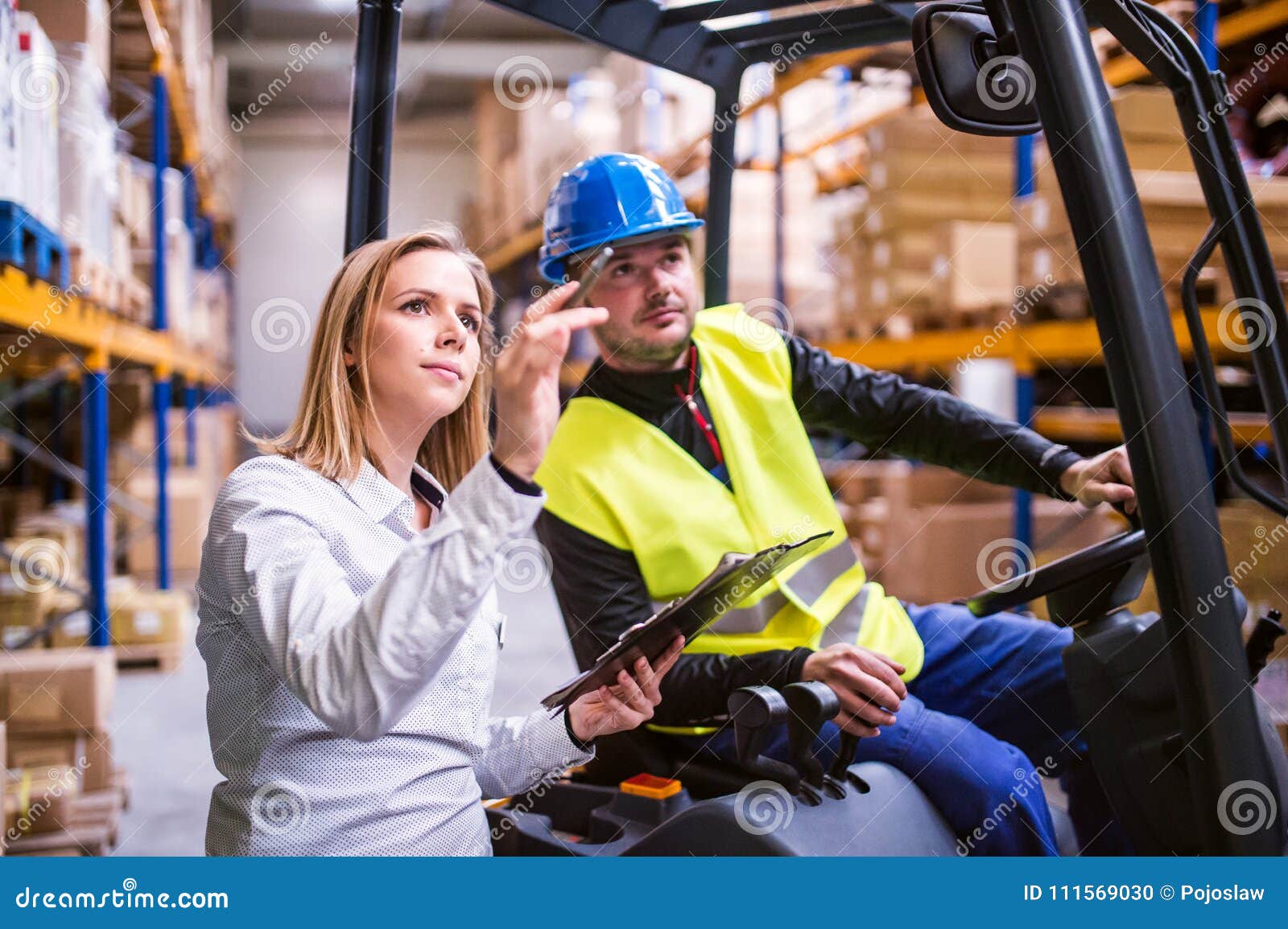 Young Warehouse Workers Working Together. Stock Photo - Image of ...