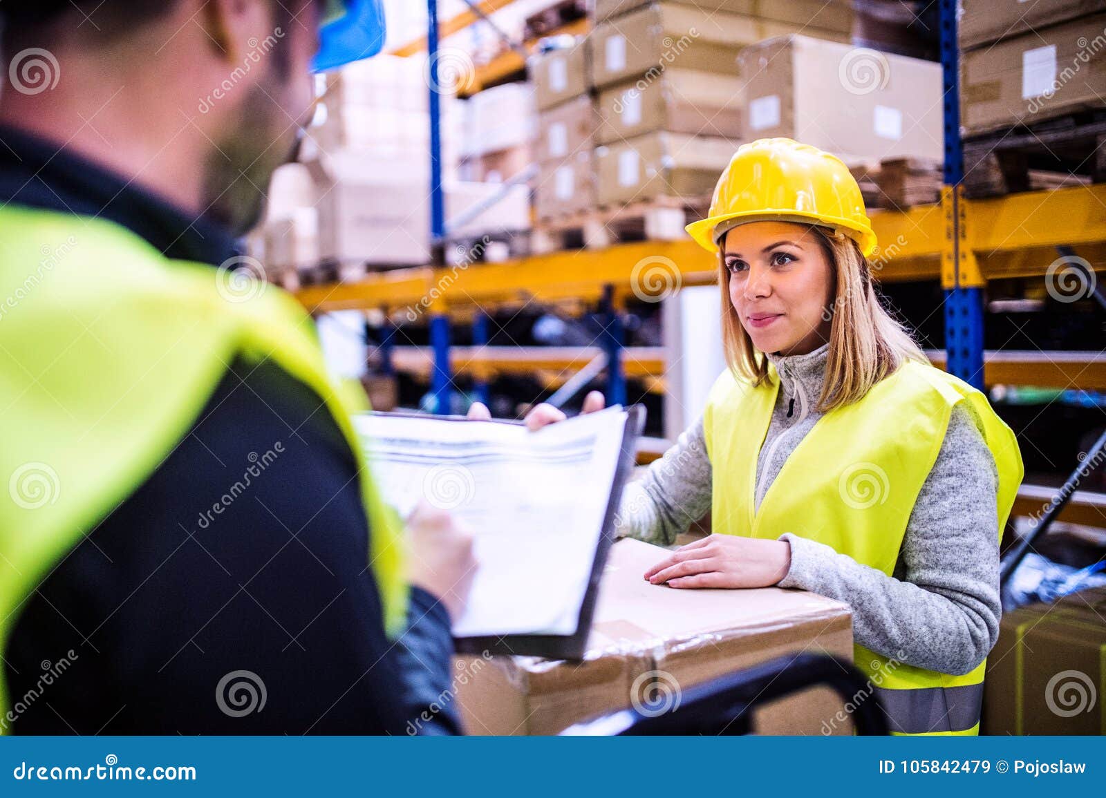 Young Warehouse Workers Working Together. Stock Image - Image of ...