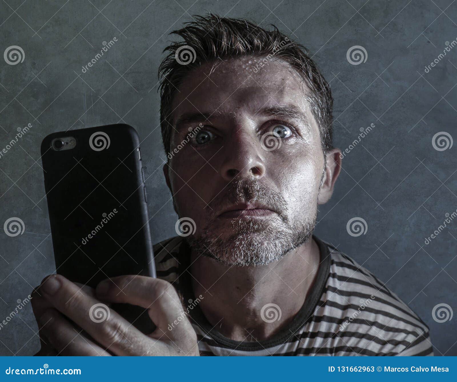 Young Weird and Crazy Mobile Phone Addict Man Using Cell Compulsively ...