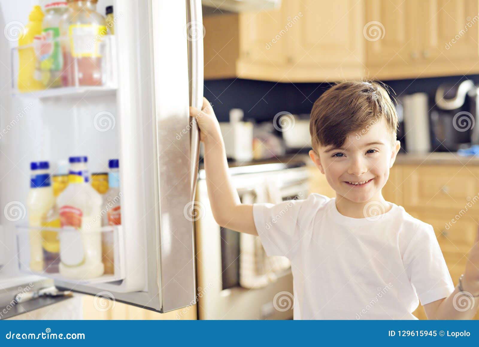 Young White Boy Standing in Front of Open Refrigerator. Stock Image ...