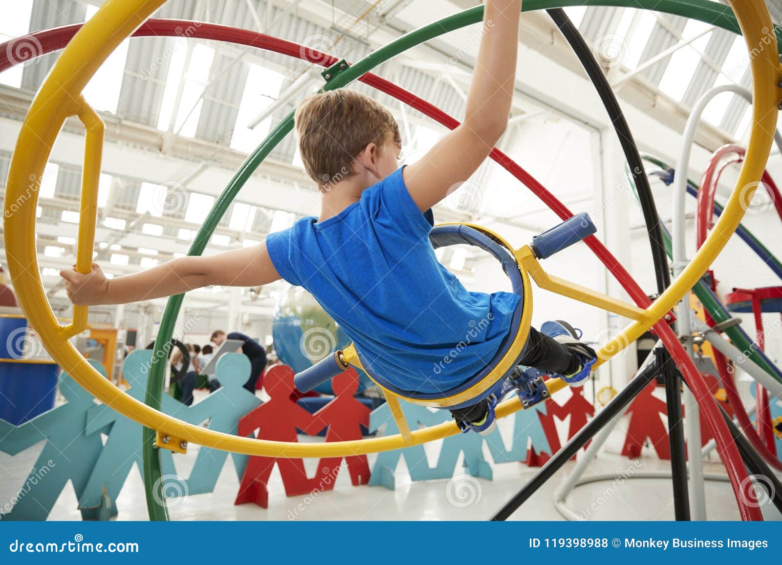 Young White Boy Using a Human Gyroscope, Back View Editorial Stock ...