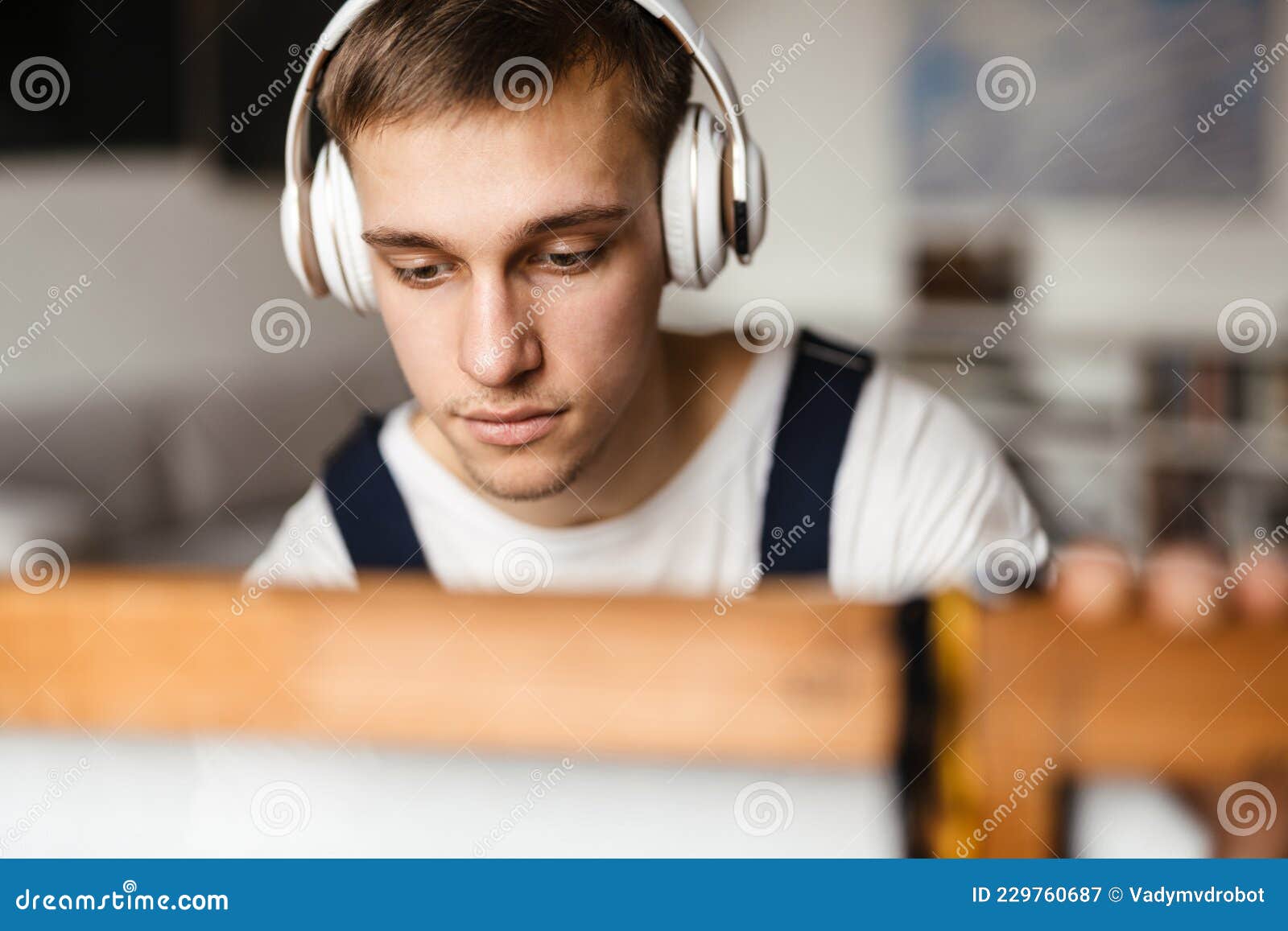 Young White Man in Headphones Working on Craft Rug Stock Image - Image ...