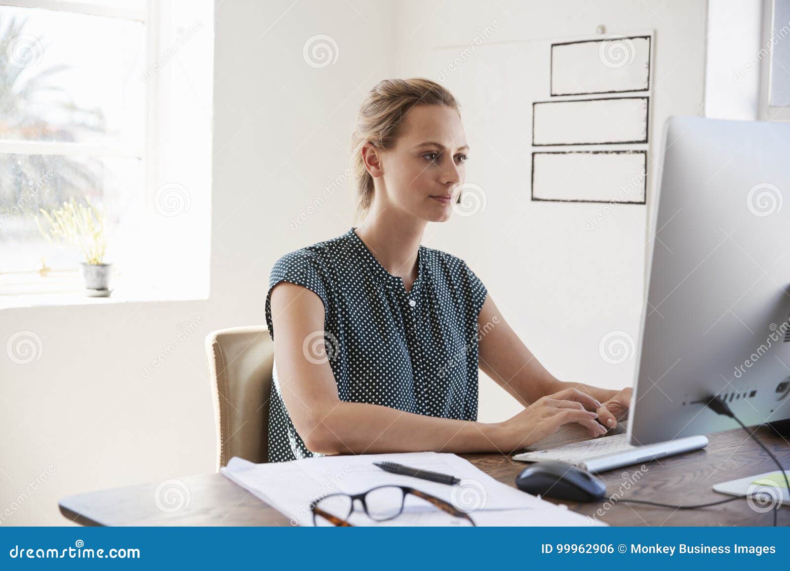 Young White Woman Working in Office Using Computer, Close Up Stock ...